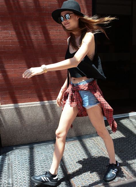 Behati Prinsloo Bares Her Midriff In Grunge Ensemble As Fiance Adam Levine Sports Ac Dc T Shirt