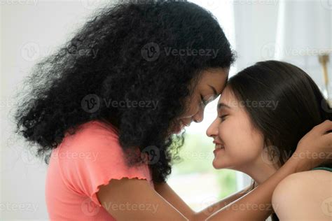 Young African American Woman Kissing Her Friend On The Lips 31607487