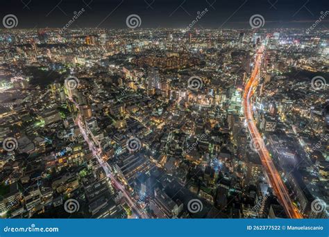 Night Aerial View Of Tokyo Skyline And Highway Car Trails On Route 3