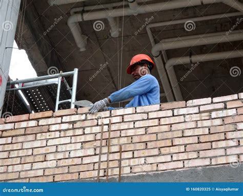 Bricklayer Lay Clay Brick And Stacked It Together Using Cement Mortar To Form Walls At The