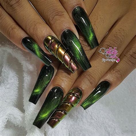 Long Coffin Nail Set With Dark Green Cats Eye Design And Chrome Ring