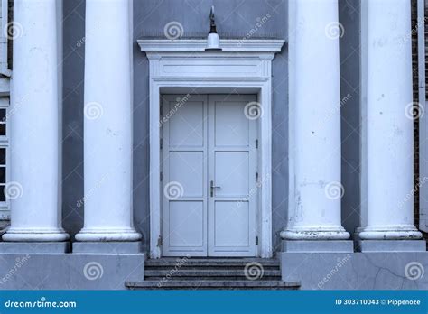 Classical White Double Doors Between Elegant Columns Stock Image