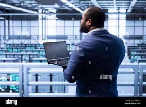 it staff member in data center implementing backup solutions to protect against infrastructure