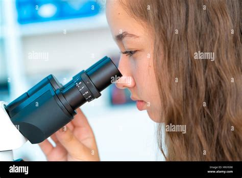 Girl In Biological Class Research With Microscope Stock Photo Alamy