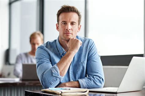 Hard Work Always Pays Off A Man Working On A Laptop In An Office Stock Image Image Of