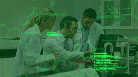 Scientists Working In A Laboratory With Data And Structural Formula Of Chemical Compounds Stock