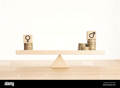 Wage Gap Between Men And Women Concept Wooden Block With Gender Symbol On Stacked Coins On A