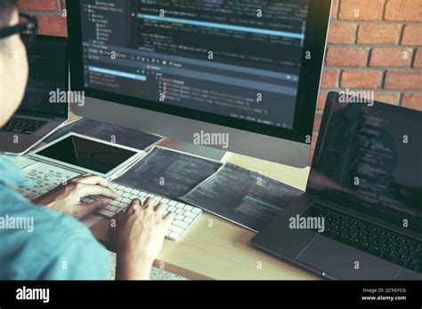 asian man working code program developer computer web development working design software on