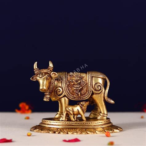 Buy This Brass Kamdhenu Carving With Radha Krishna Devsabha