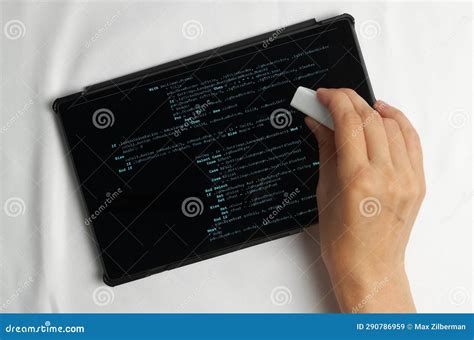 Programming And Coding Concept Program Code Creation Hand With Eraser Erases Erroneous Part Of