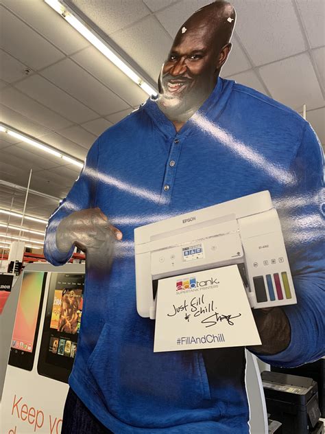 Shaq Holding An Epson Printer Scrolller
