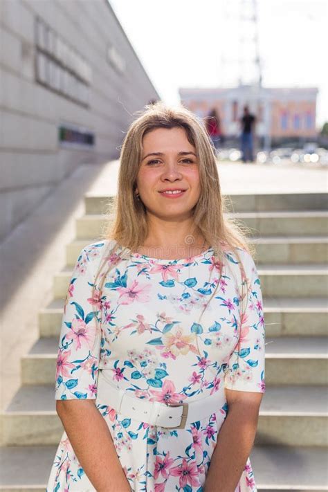 Portrait Of A Beautiful Young Caucasian Blonde Cheerful Girl Outdoor