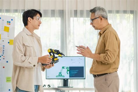 Engineering Robot Technology With Asian Programmer Innovation And Research Teamwork In Coding