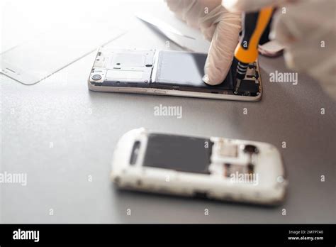 Technician Prepairing To Repair And Replace New Screen Broken And Cracked Screen Smartphone