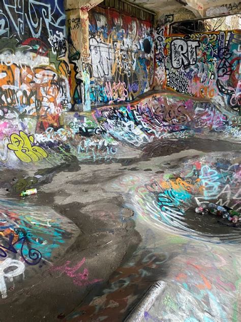 Abandoned Skate Park With Graffiti Walls
