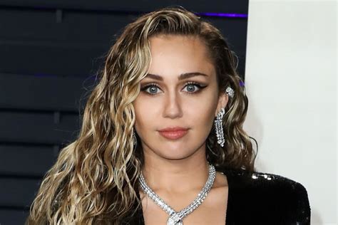 Miley Cyrus Reveals Bondage Inspired Outfit With Strappy Sandals For