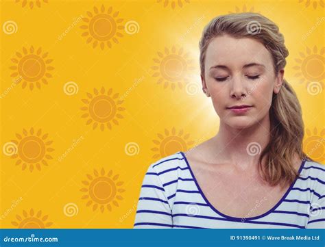 Woman With Eyes Closed Against Yellow Sun Pattern Stock Image Image