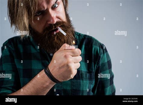 Smoke A Cigarette Bearded Man Mature Hipster With Beard Use A Lighter Brutal Caucasian