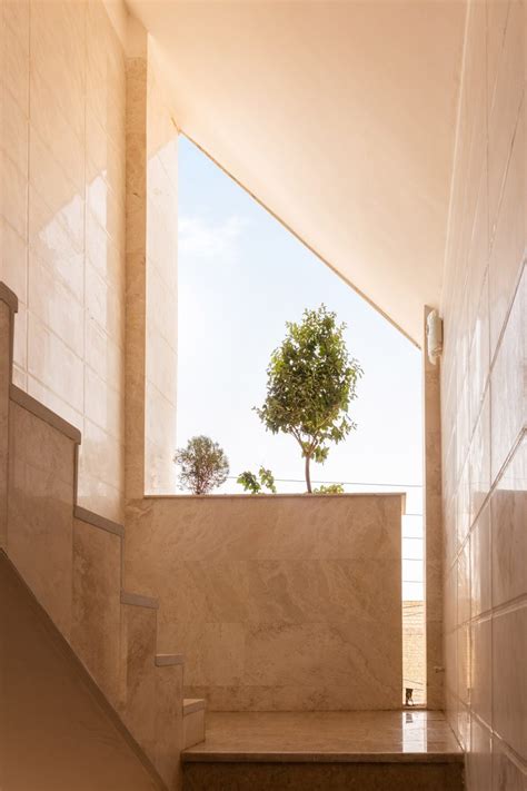 Awe Office Creates Apartments With Angular Stone Clad Facade In Iran