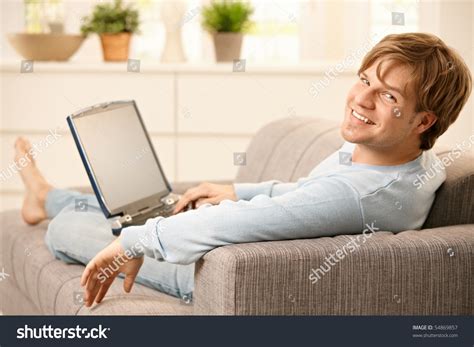 Man Sitting Laptop Computer On Sofa Stock Photo 54869857 Shutterstock