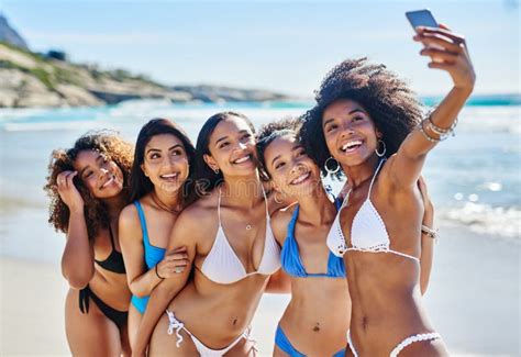 If Youre Not At The Beach Youre Not Having Fun A Group Of Happy Young Women Taking Selfies