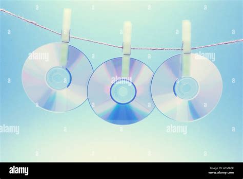 CDs Hanging On String With Clothes Pegs Stock Photo Alamy