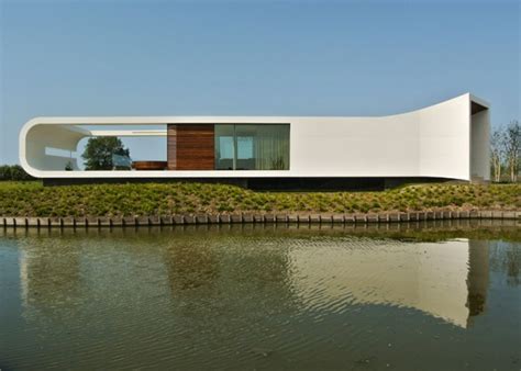 Corian Facade Wraps Around Waterside Dutch Home