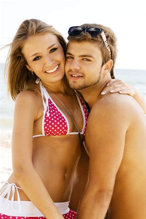 Young Cheerful Couple Having Fun On The Beach Stock Image Image Of