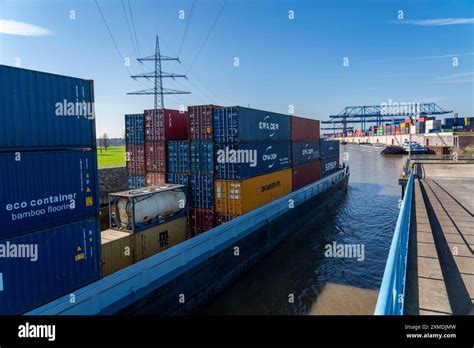 Container Cargo Ship Enters The Port Basin Of The Logport Gantry