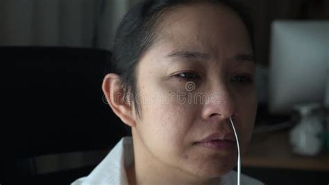 Asian Adult Woman Tear Crying Reaction From Covid 19 Nasal Test Kit