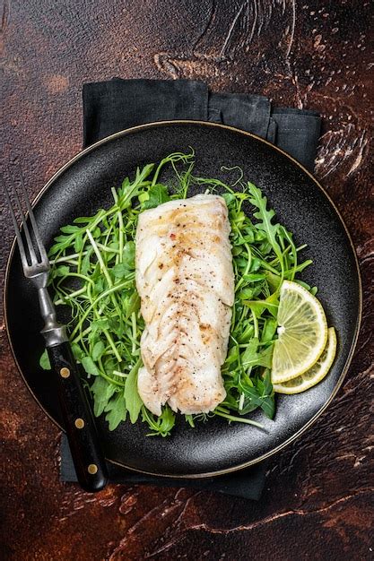 Premium Photo Grilled Cod Fish Fillet Served With Green Salad In A