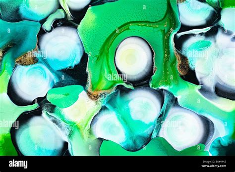 A Mesmerizing Abstract Composition Featuring Teal And Green Hues Fluid