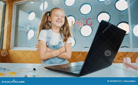 Smart Cute Girl Using Laptop While Looking And Laughing At Camera Erudition Stock Image