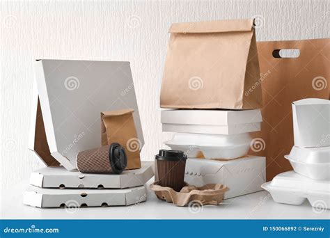 Assortment Of Food Delivery Containers On White Table Royalty Free