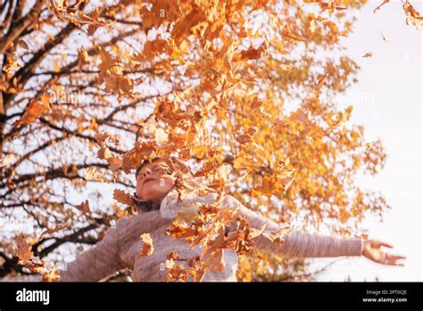 Partially Blurred Boy 9 10 Years Old Stands In Autumn Park In Rays Of