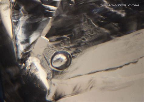 A Gas Bubble Trapped In A Cavity Within A Quartz Gemstone From Brazil