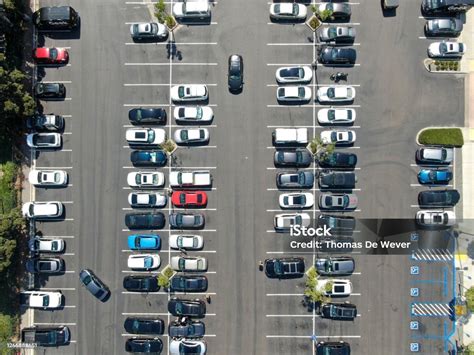 Aerial Top View Of Parking Lot At Shopping Mall With Varieties Of