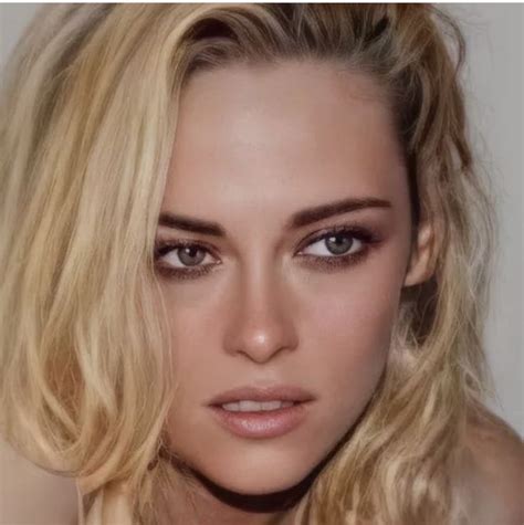 A Woman With Long Blonde Hair And Blue Eyes