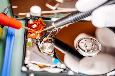Premium Photo Man Repairing Hard Drive In Service Center Repairing And Fixing Service In Lab