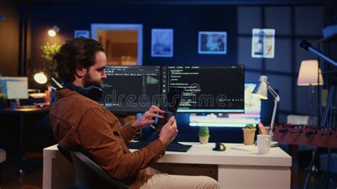 It Admin Holding Table Using It As Reference While Coding On Computer