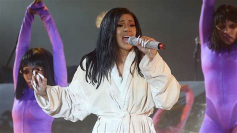 Cardi B Performs In A Bathrobe After Her Costume Rips Onstage Entertainment Tonight