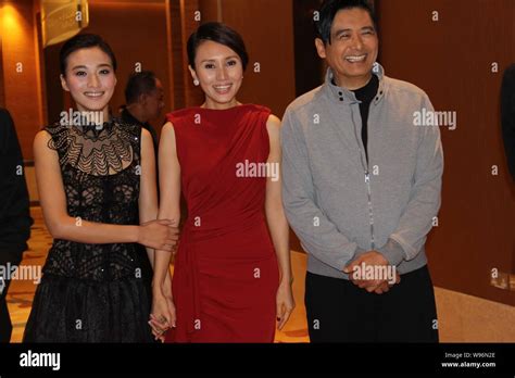 Cast Members From Left Joyce Feng Yolanda Yuan And Chow Yun Fat Pose For Photographers As