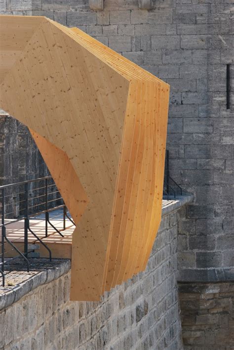 Nas Architecture Installs Wooden Vortex Over Medieval Wall