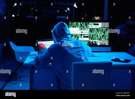 Getting Ready To Unleash Another Cyber Attack Rearview Shot Of A Male