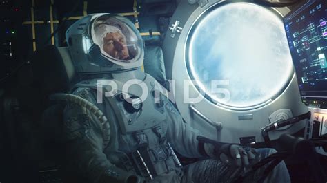 Astronaut Inside Rocket Cockpit