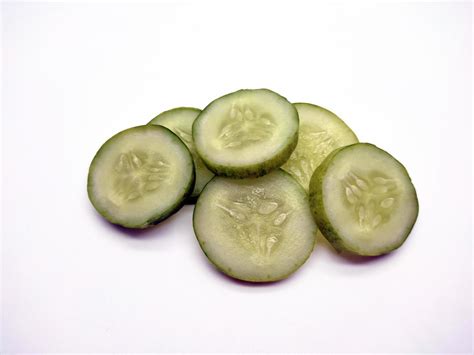 Cucumber Slices Arranged Parallel Isolated In White Background 21232462