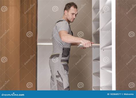 Constraction Male Assembling Cabinets In Closet Stock Image Image Of