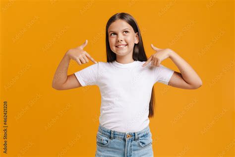 White Brunette Girl Smiling While Pointing Finger At Herself Stock