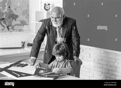 Elementary School Elementary School Teacher Giving Female Pupil