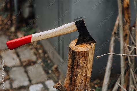 Chopping With An Ax A Cracked Log Tree In The Open Air Nature In The Forest Close Up